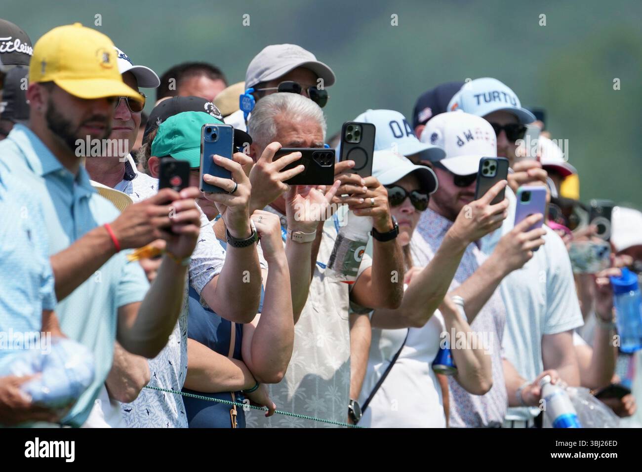 Fans line the first fairway during the first round of the U.S. Open ...