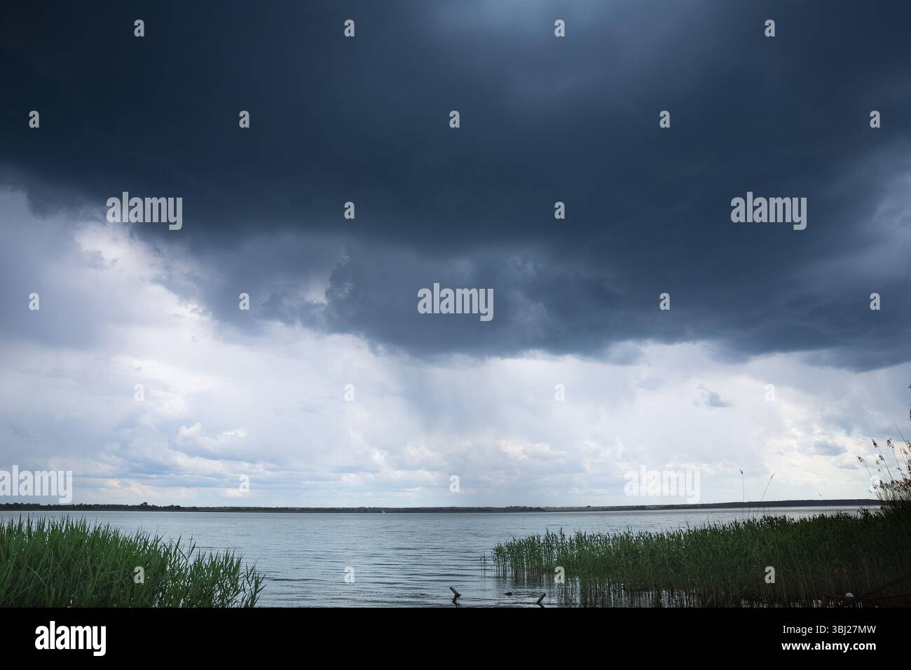 Dark ominous storm clouds appear hi-res stock photography and images ...