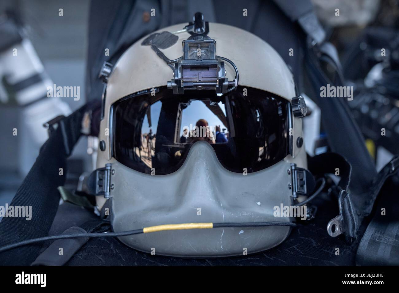 A flight helmet rests on a seat in a U.S. Army UH-60M Black Hawk ...