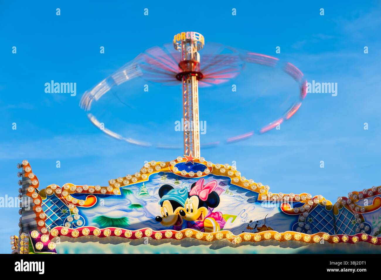 Maastricht, Netherlands - May 12, 2025: A colorful amusement park ride ...