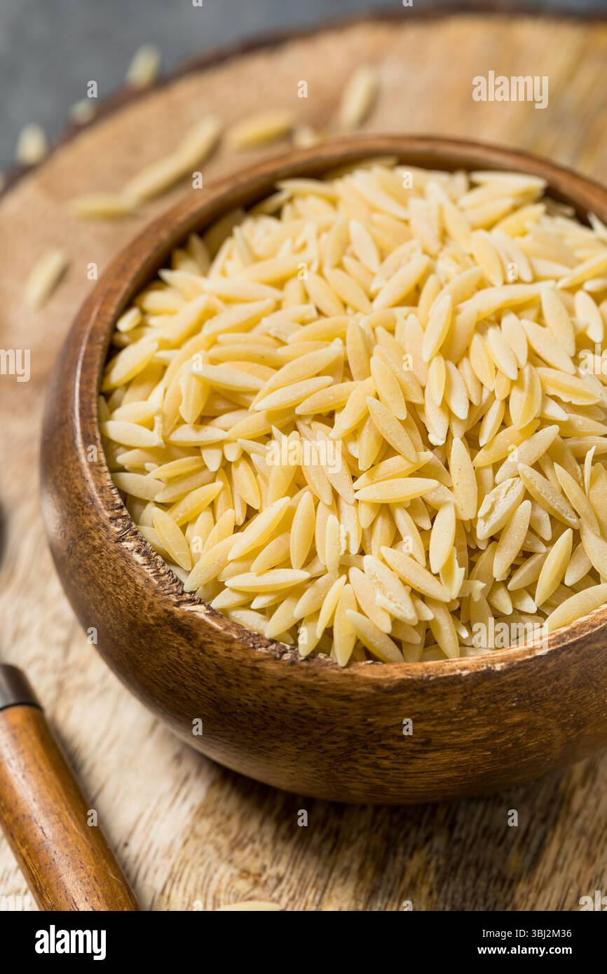 Organic Dried Orzo Pasta in a Bowl to Cook Stock Photo - Alamy
