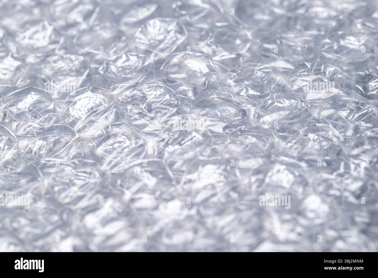 Bubble wrap macro photo with selective focus. It is a pliable ...