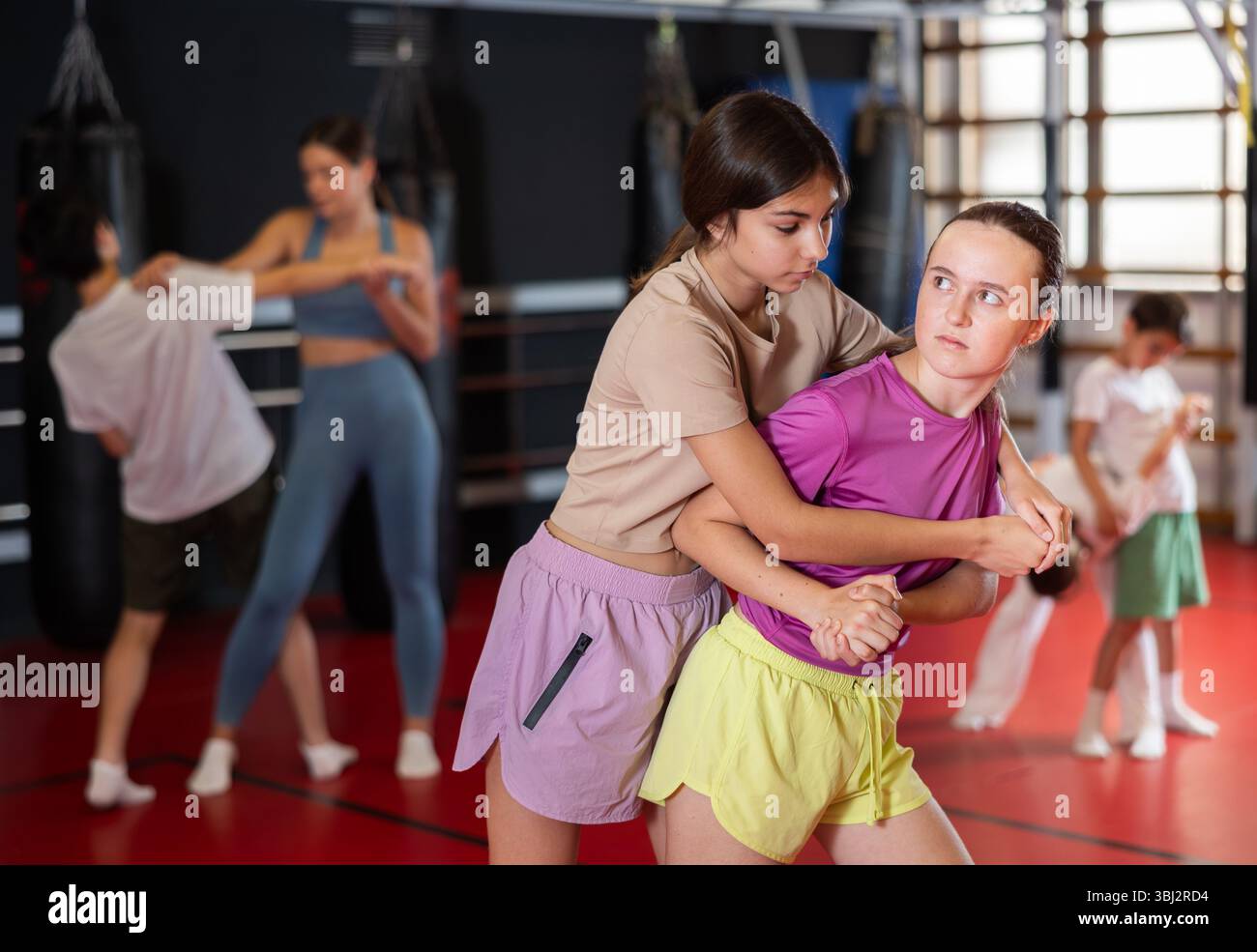 Girls practice self-defense strikes in the gym Stock Photo - Alamy