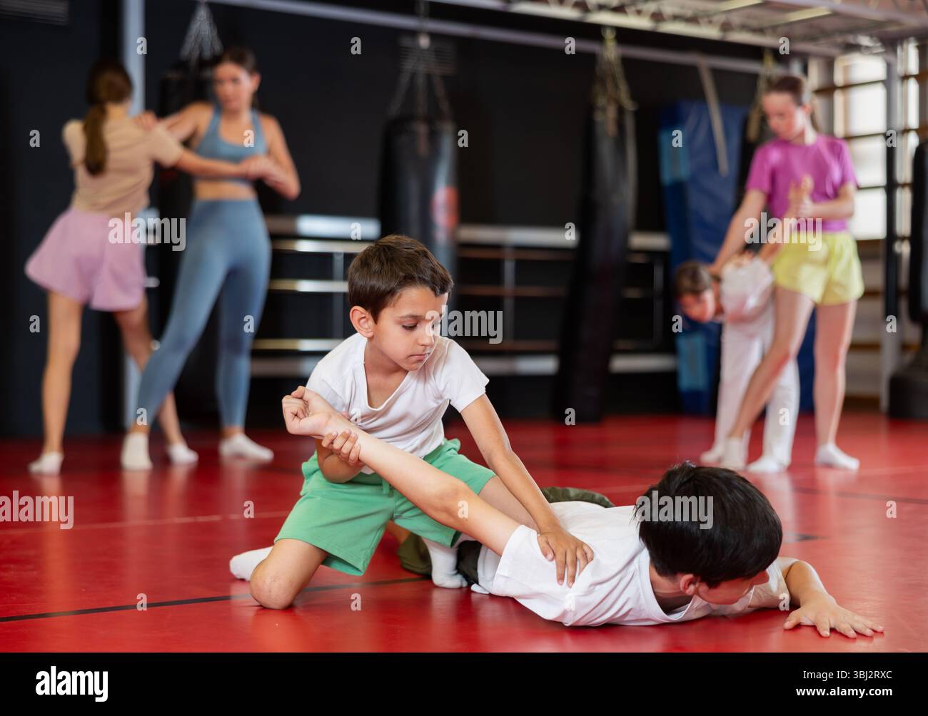 Two boys practice self-defense in pairs Stock Photo - Alamy