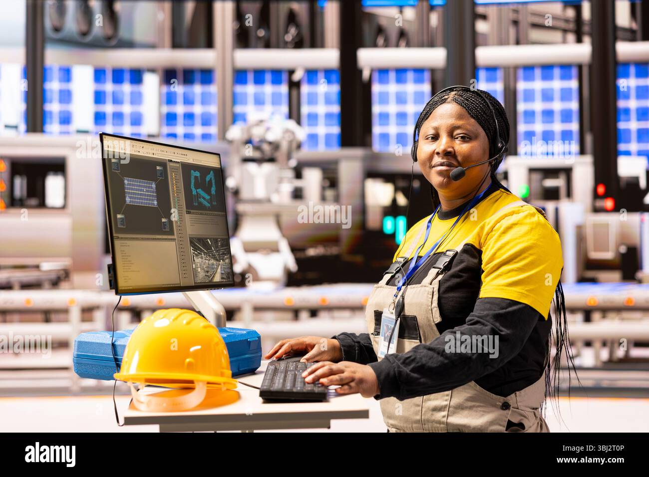Female technician with headset supervising automated production line ...