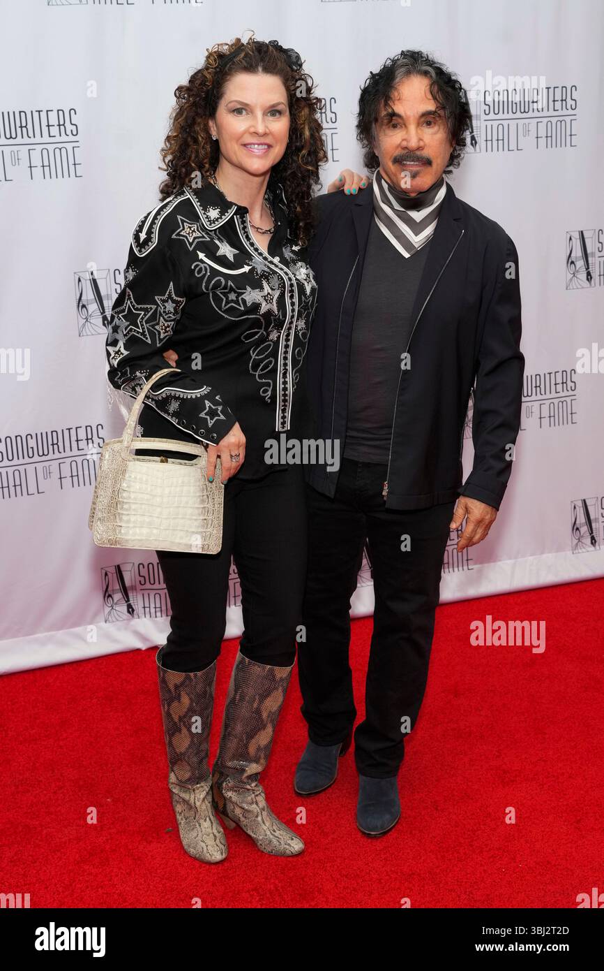 Aimee Oates, left, and John Oates attend the 54th annual Songwriters ...