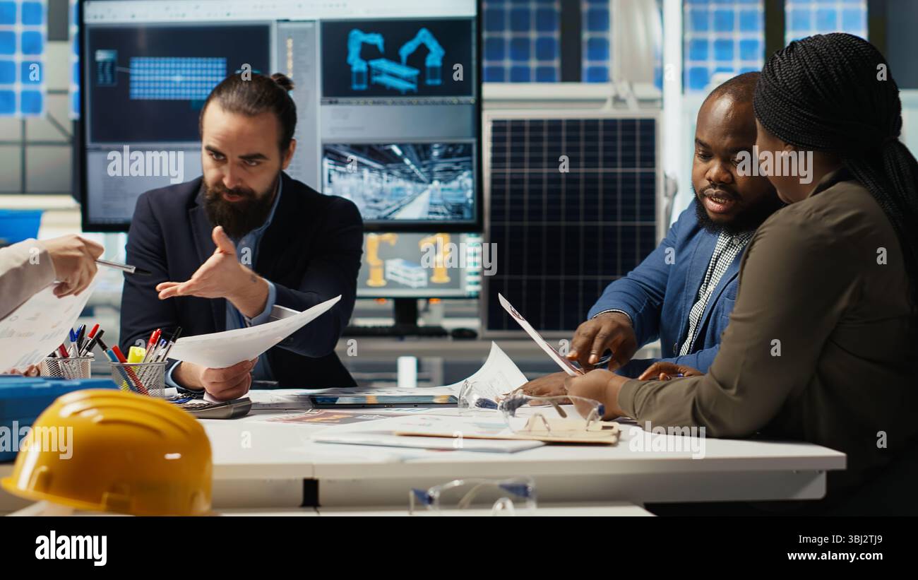 Engineers study detailed schematics hi-res stock photography and images ...