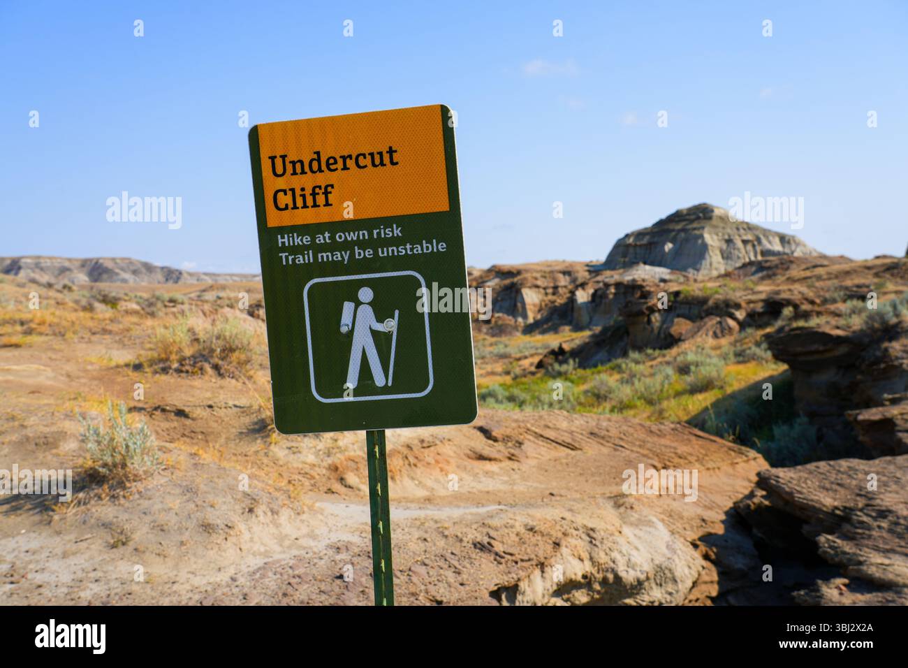 "Undercut cliff" warning sign along a trail of the Dinosaur Provincial ...
