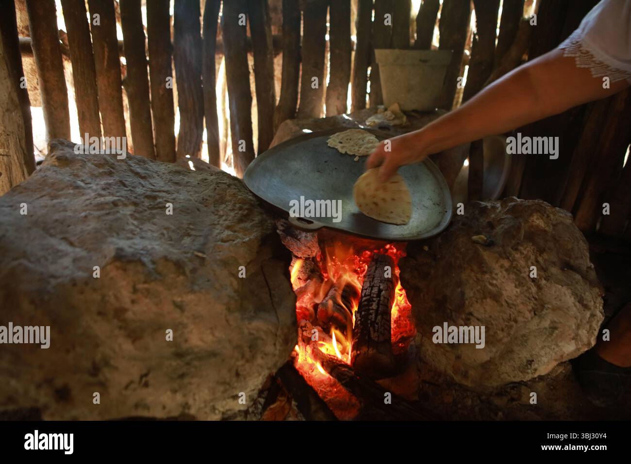 Making tortillas by the Mayans using the traditional method in the ...