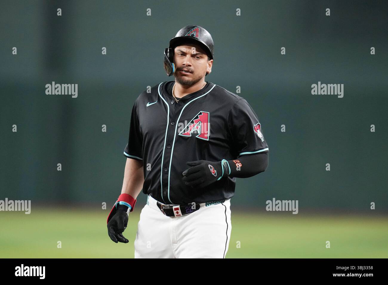 Arizona Diamondbacks' Josh Naylor pauses at first base after hitting a ...