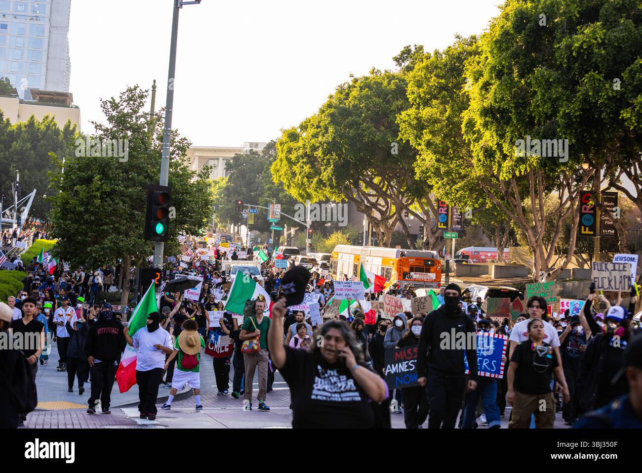 A large crowd of diverse protesters rally in downtown Los Angeles with ...