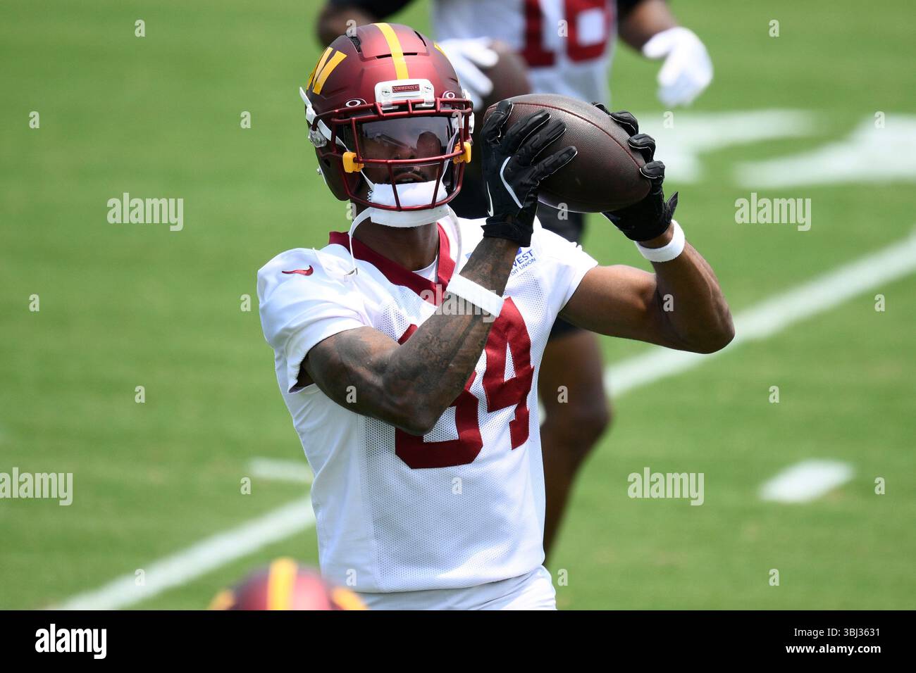 Washington Commanders wide receiver Mike Strachan (84) works out during ...