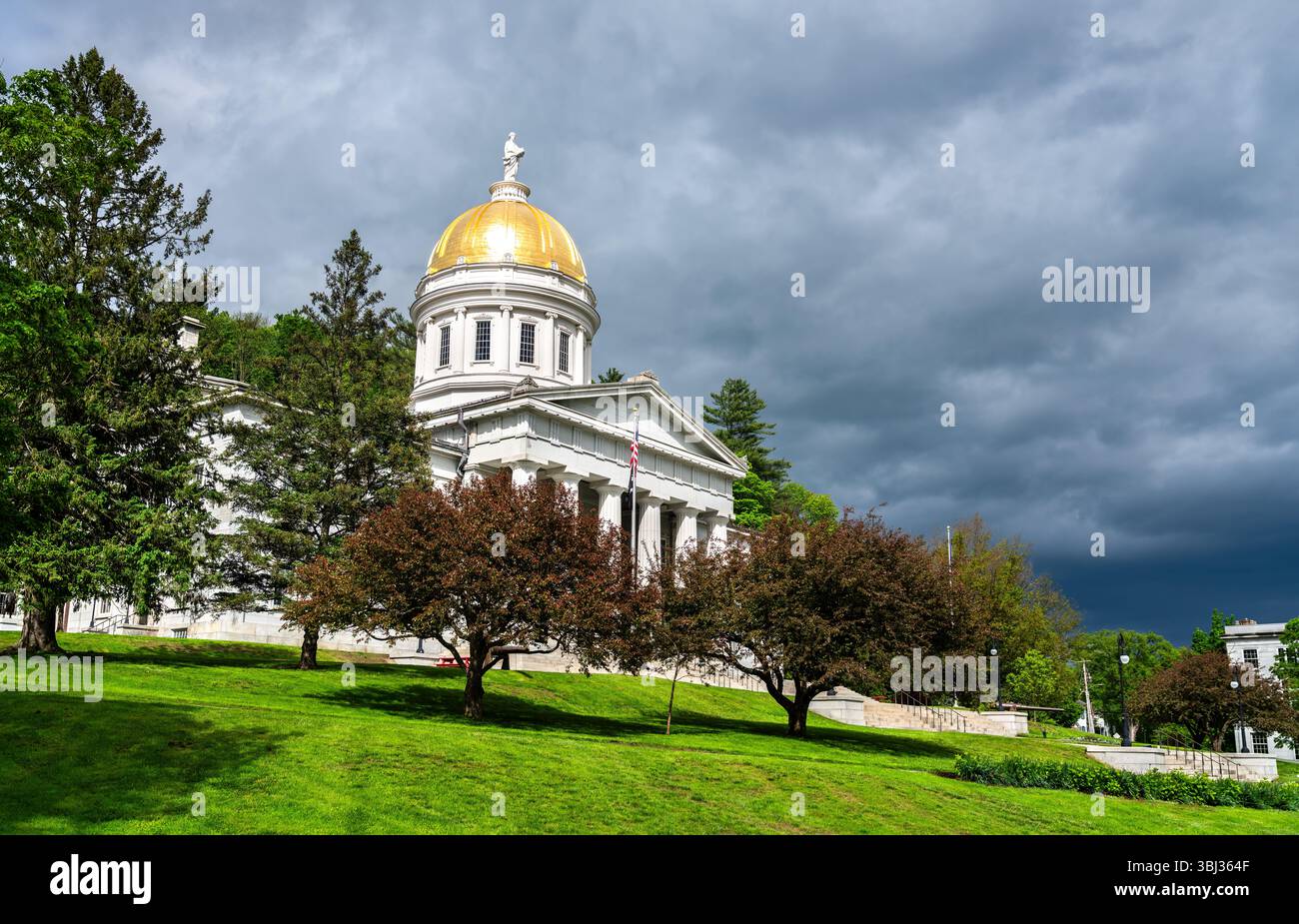 Front view of the Vermont State House in Montpelier, featuring a gold ...