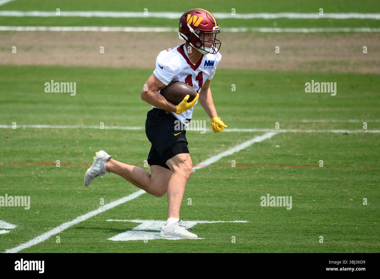 Washington Commanders wide receiver Luke McCaffrey (11) works out ...