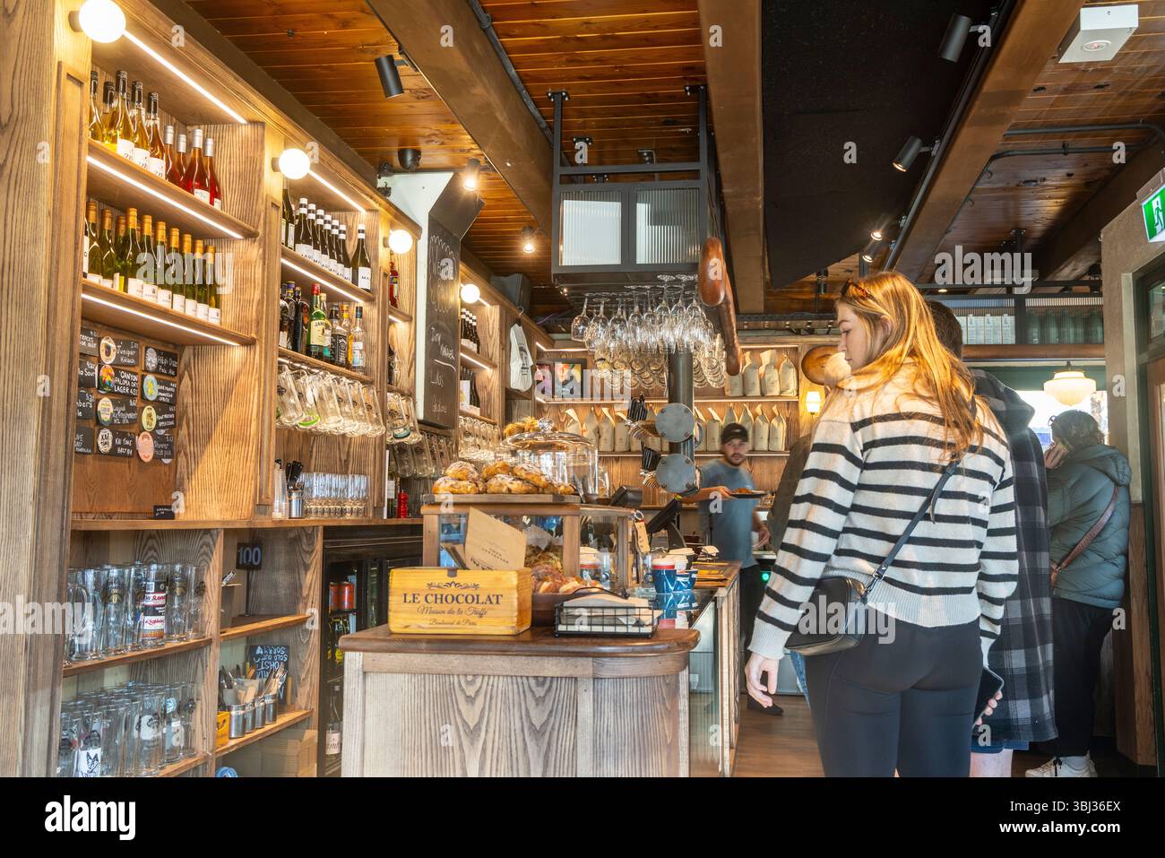Wanaka town centre cafe, South Island,New Zealand, customer inside cafe ...