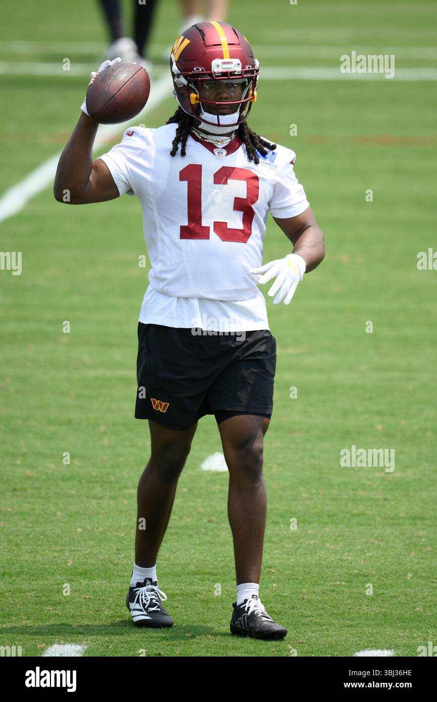 Washington Commanders wide receiver K.J. Osborn (13) works out during ...