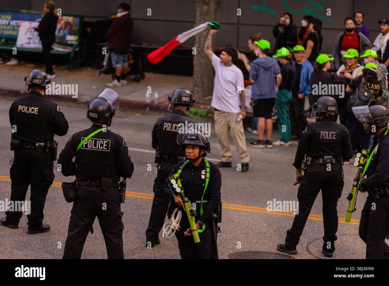 A large crowd of diverse protesters rally in downtown Los Angeles with ...