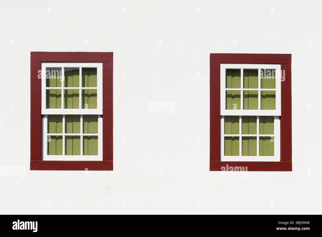 Colourful colonial style windows Stock Photo - Alamy