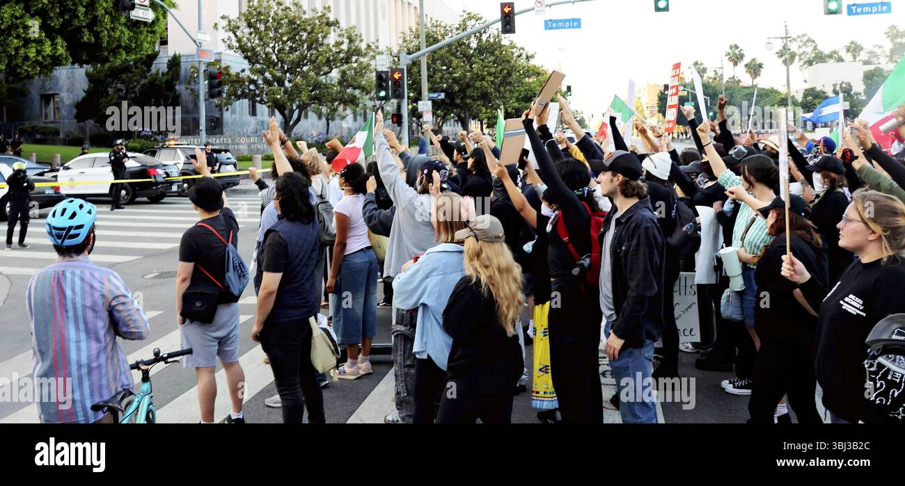 Demonstrators protest by raising Latin American flags and others in ...