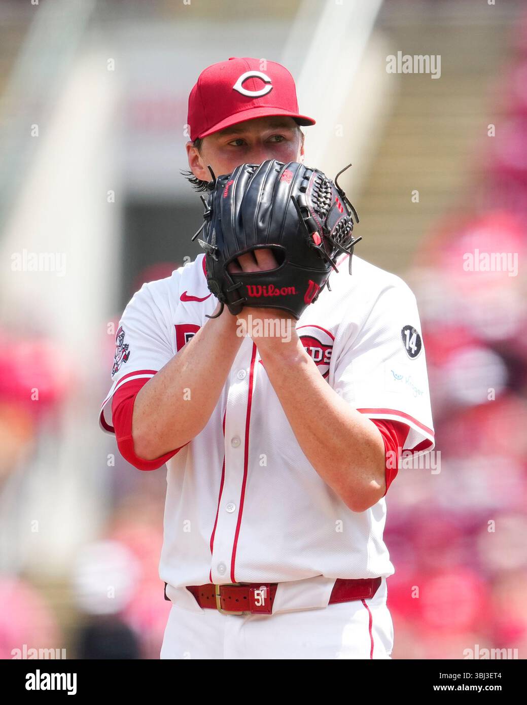Cincinnati Reds pitcher Brady Singer looks to throw during a baseball ...