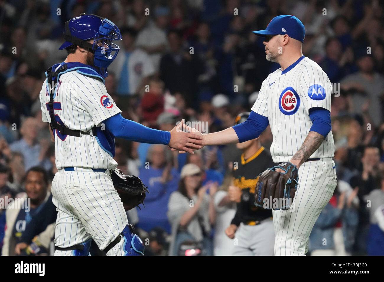 Chicago Cubs catcher Carson Kelly, left, celebrates with relief pitcher ...