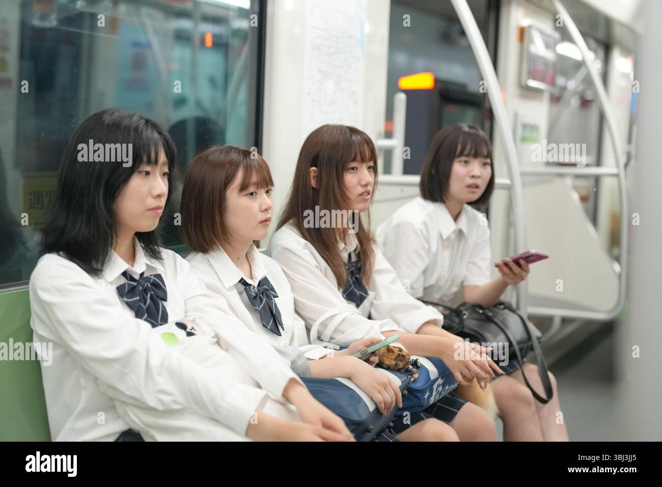 On a spring morning in the Shanghai subway, a group of Japanese high ...