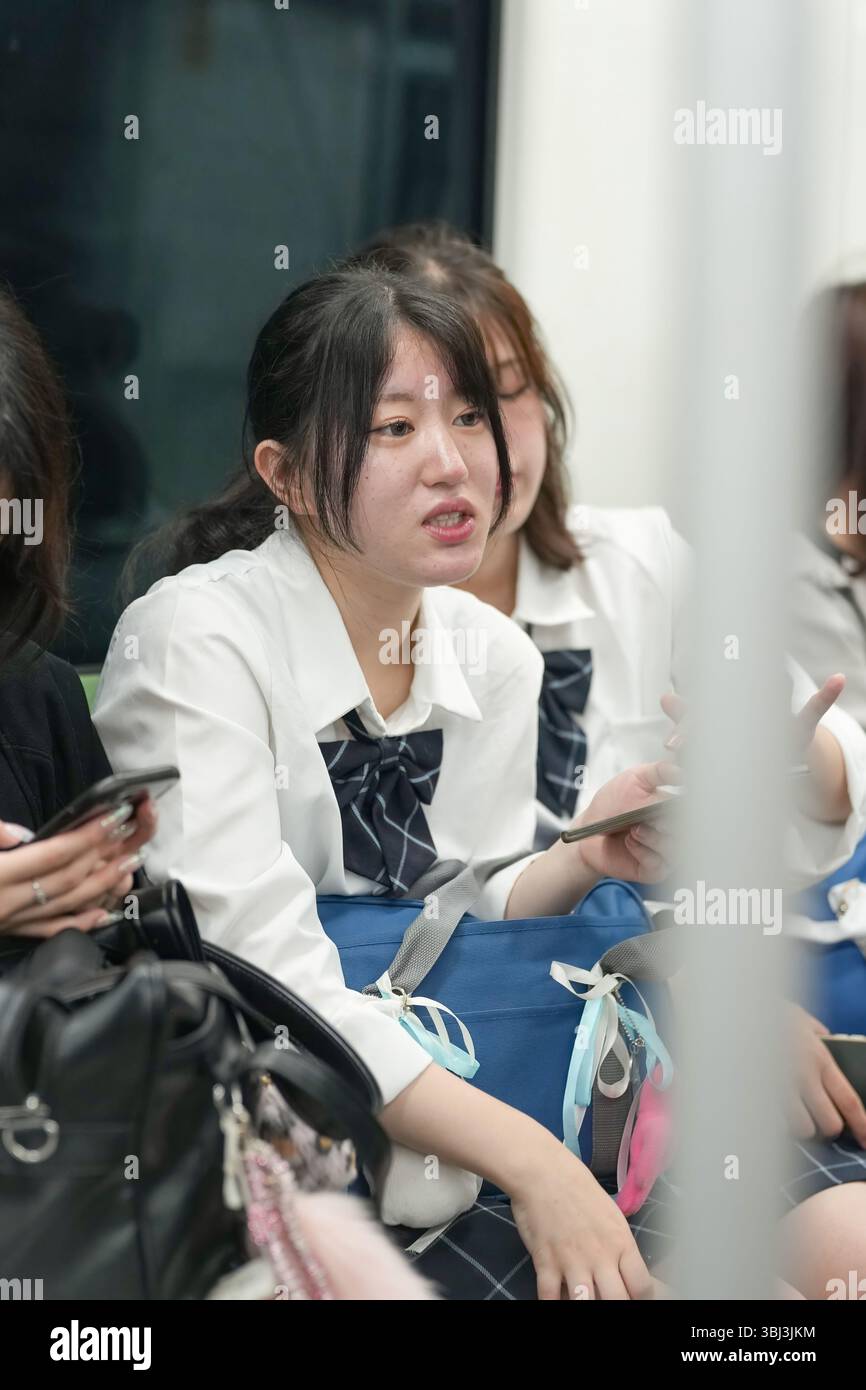 On a spring morning in the Shanghai subway, a group of Japanese high ...
