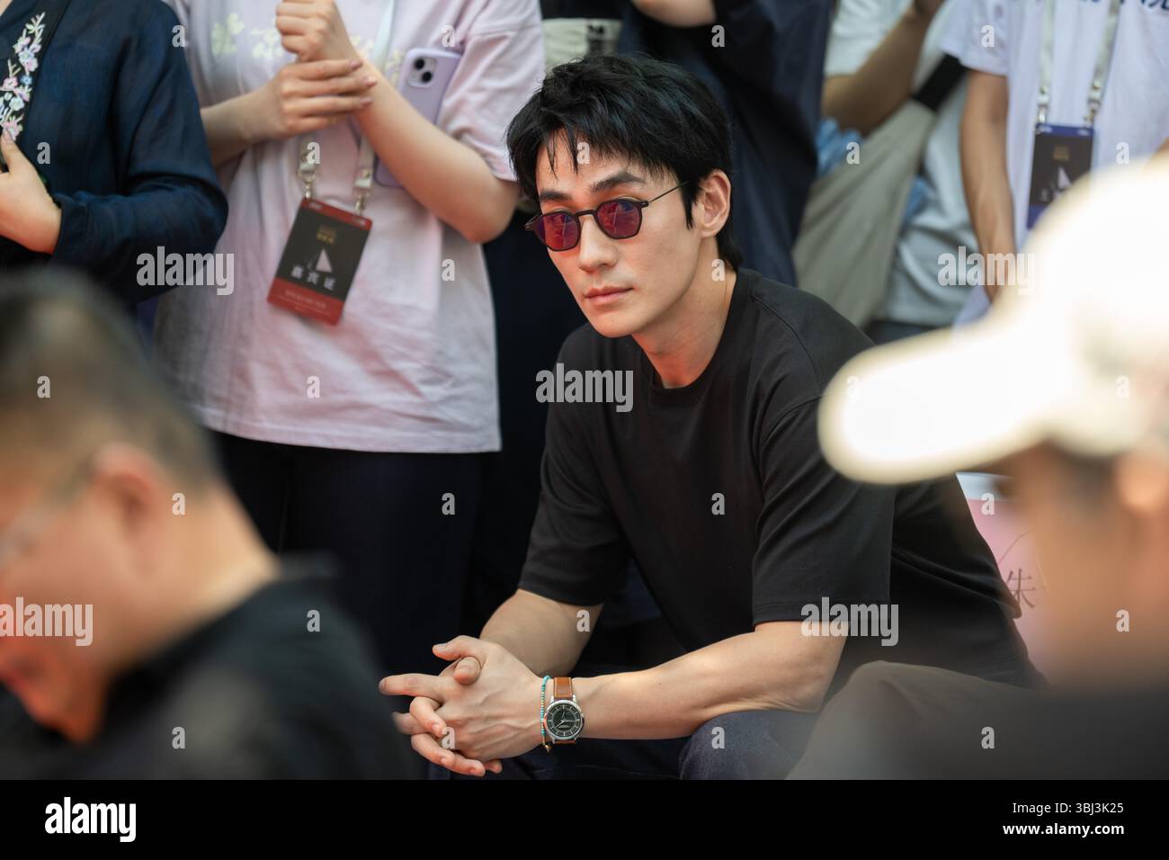Chinese actor Zhu Yilong attends an activity in Beijing, China, 12 June ...