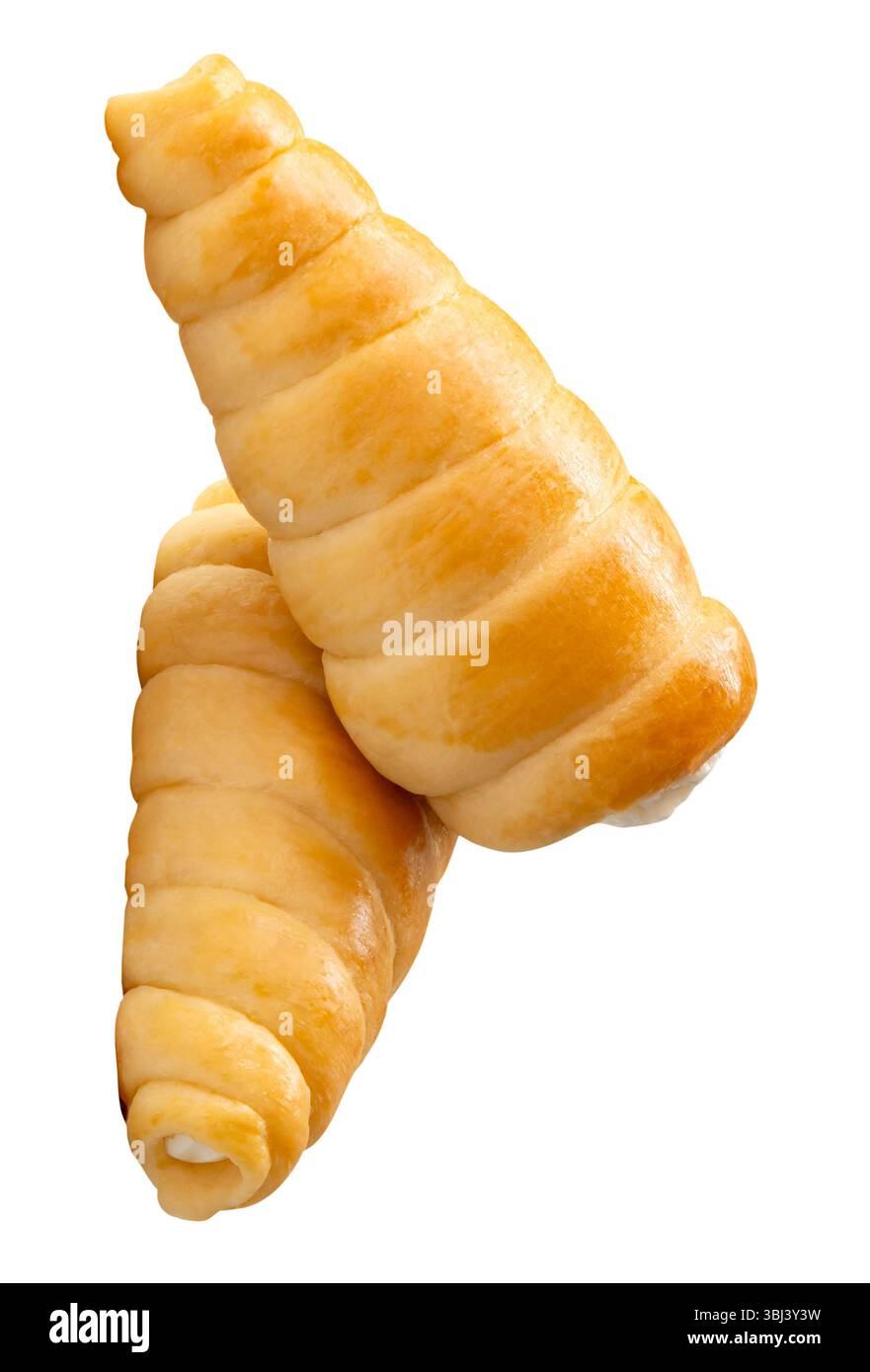 Side view of two puff pastry cream horns in stack is isolated on white ...