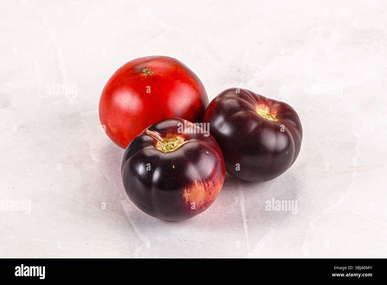 Tomatoes indigo rose ripe hi-res stock photography and images - Alamy