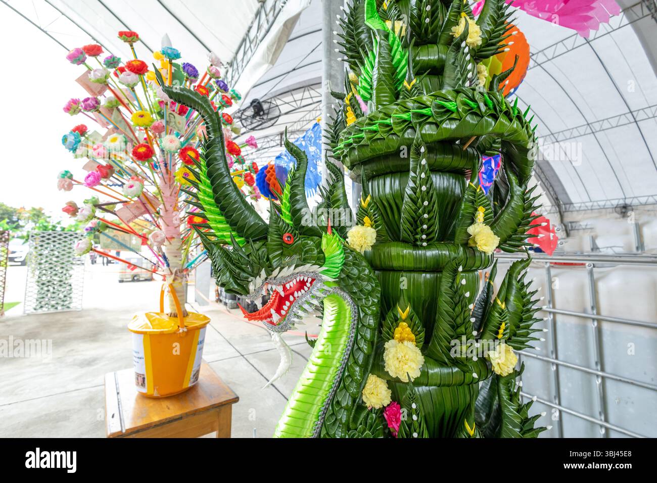 rice offering ceremony with Thai Naga banana leaf Stock Photo - Alamy