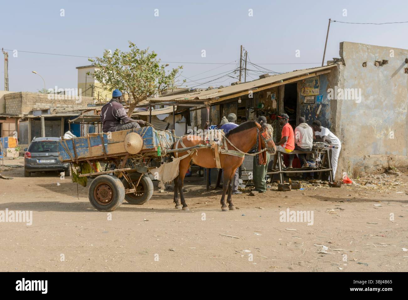 Local Senegalese people gather at the daily food market in Mbour ...