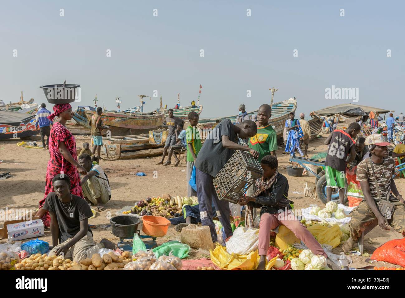Daily fish market on the beach in Mbour, Petite Cote, Thies Region ...
