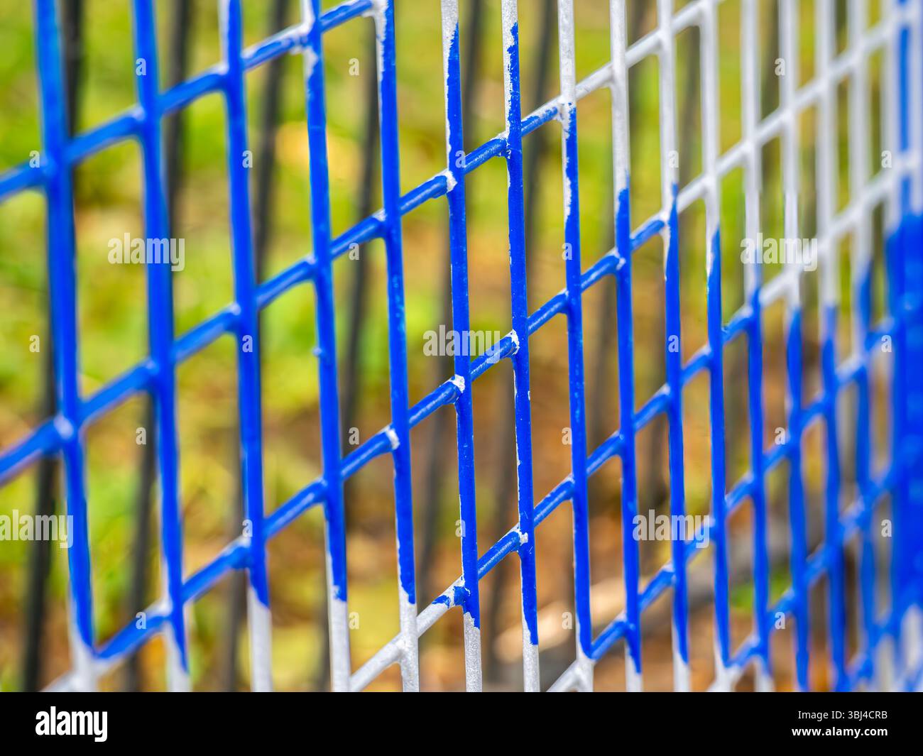 Metal mesh fencing against modern hi-res stock photography and images ...