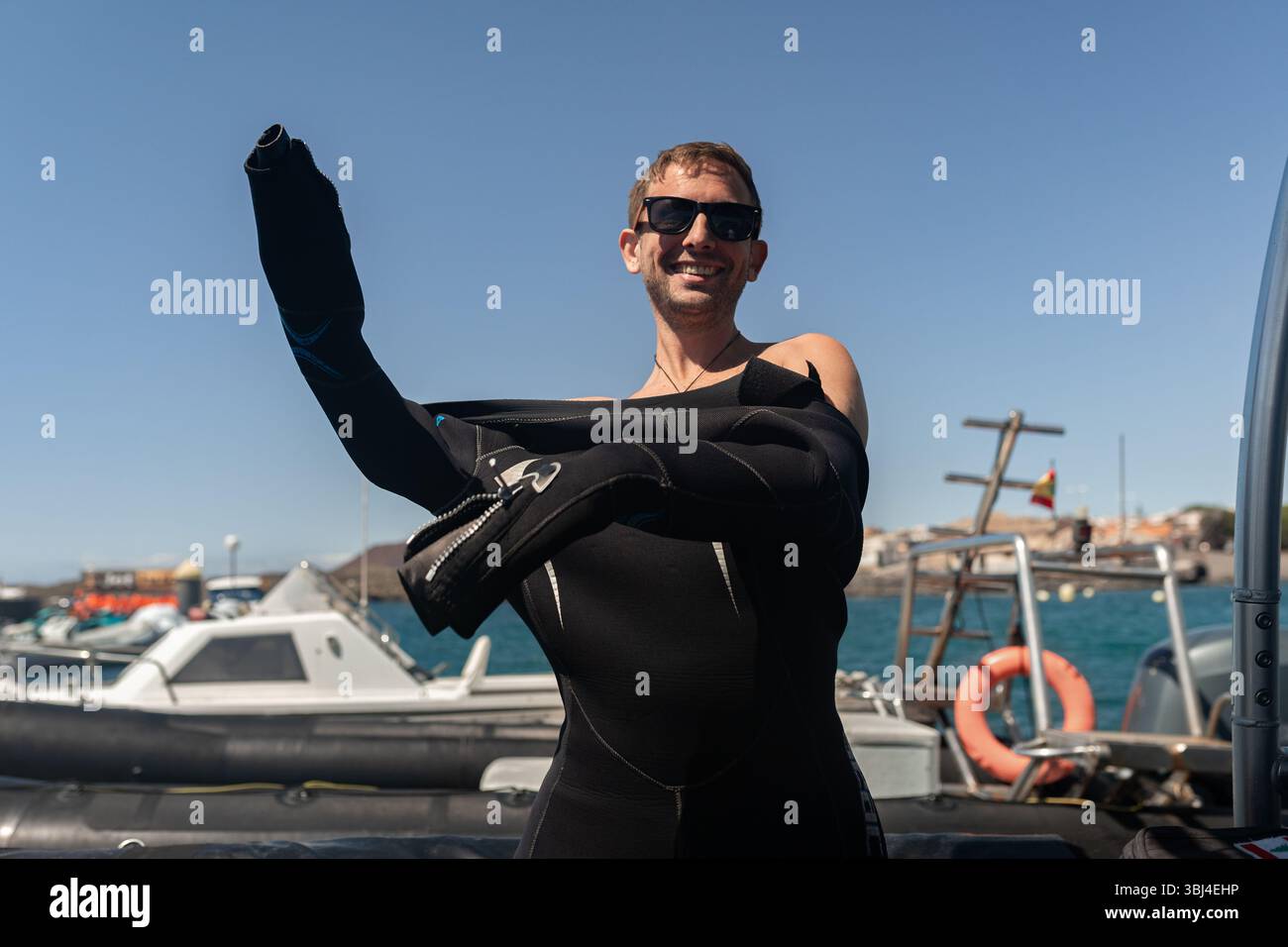 Wetsuit fitting hi-res stock photography and images - Alamy