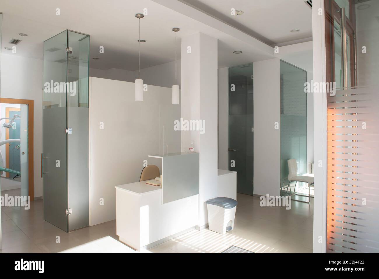 Sunlight illuminating the modern and clean reception area of a dental ...