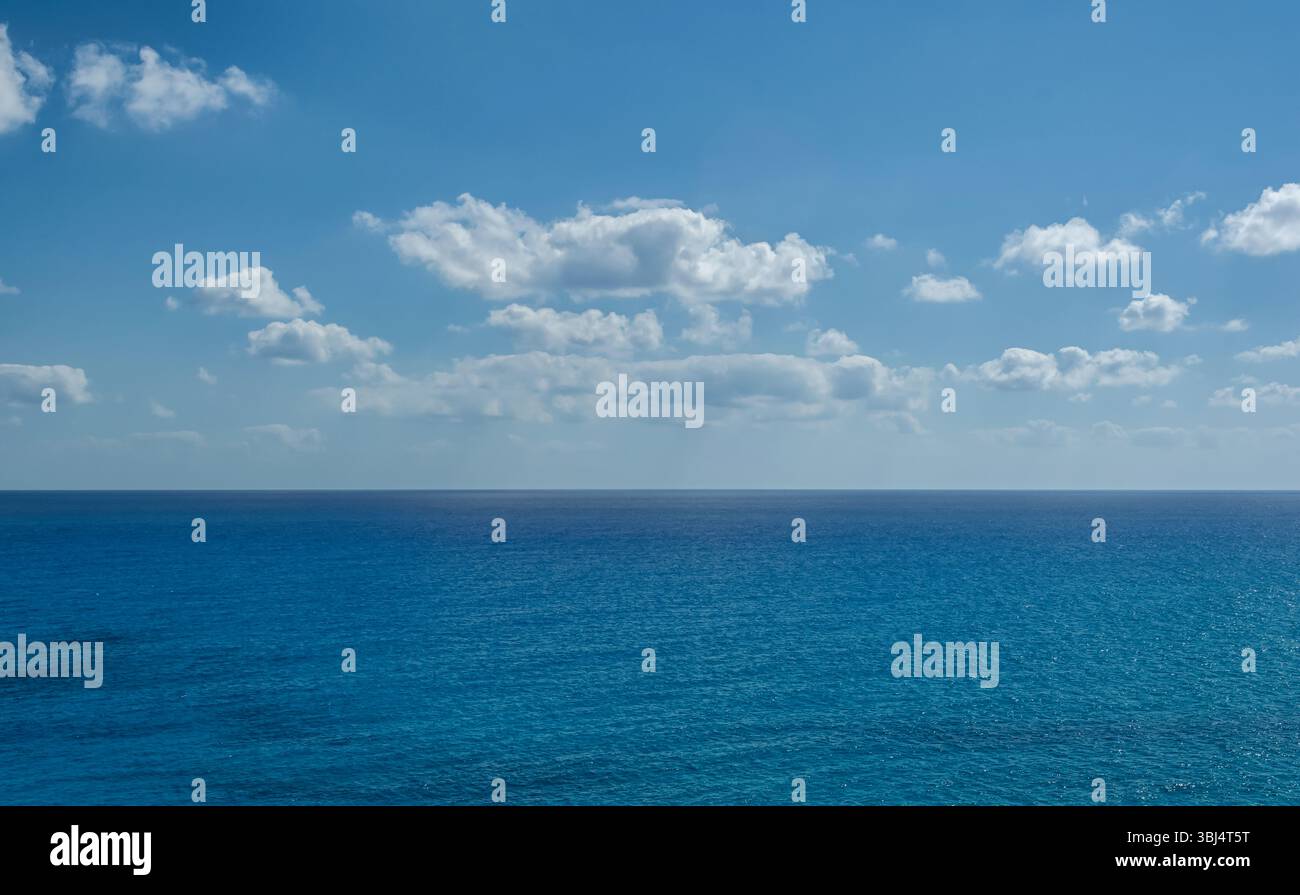 Calm sea under blue sky hi-res stock photography and images - Alamy