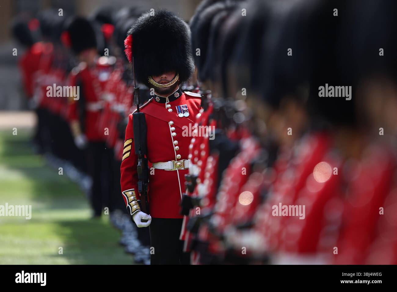 Members of The Coldstream Guards prepare inside the Quadrangle ahead of ...
