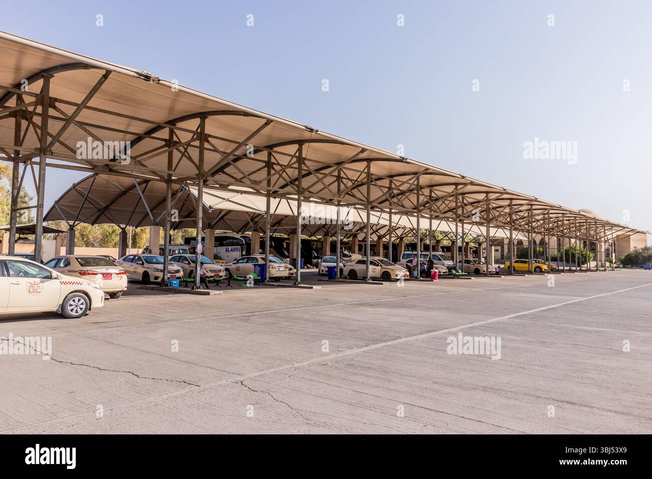 ERBIL, IRAQ - OCTOBER 8, 2022: Intercity taxis wait at the Erbil ...