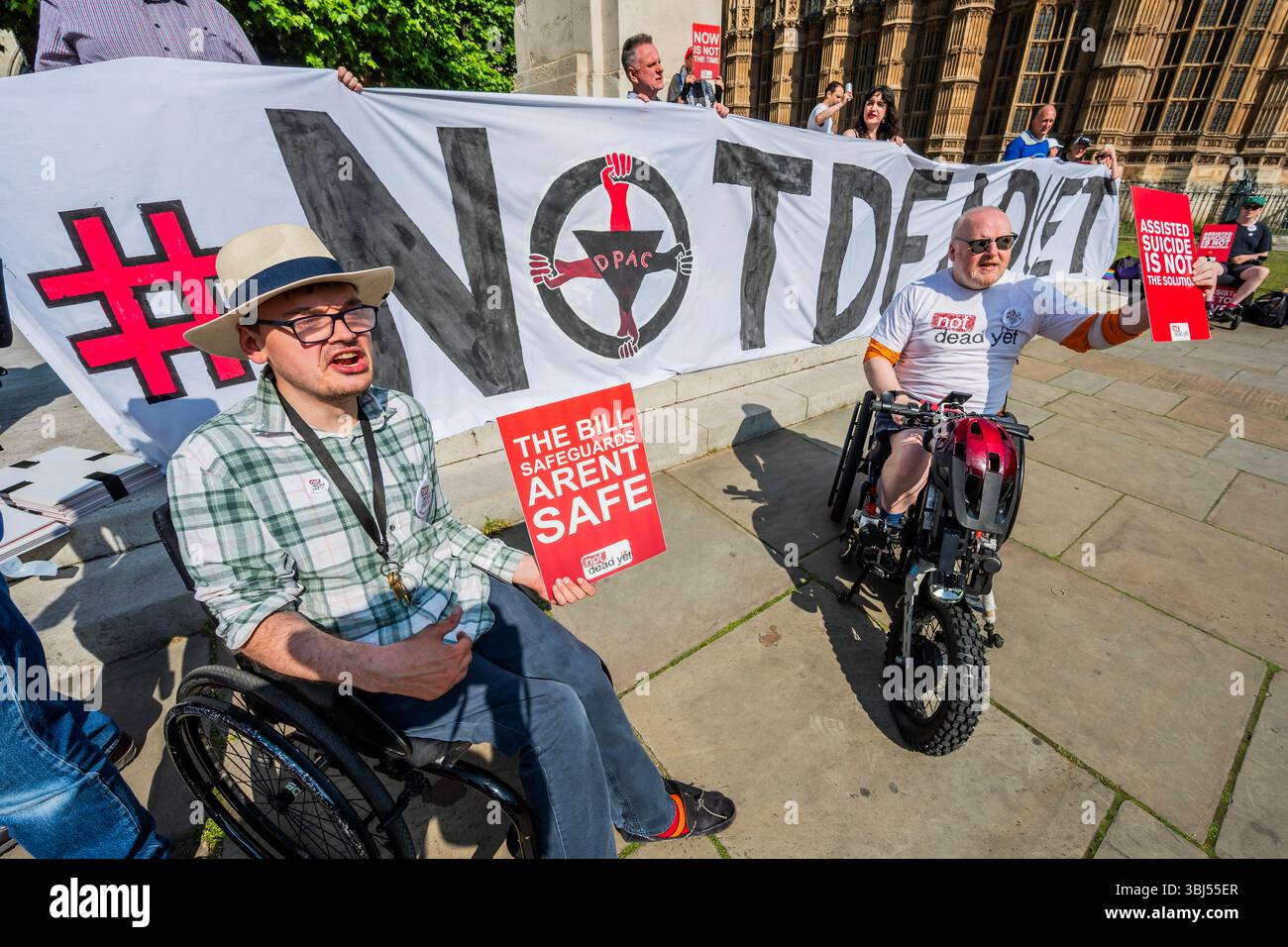 London, UK. 13 Jun 2025. DPAC protesters join the protest with a banner ...