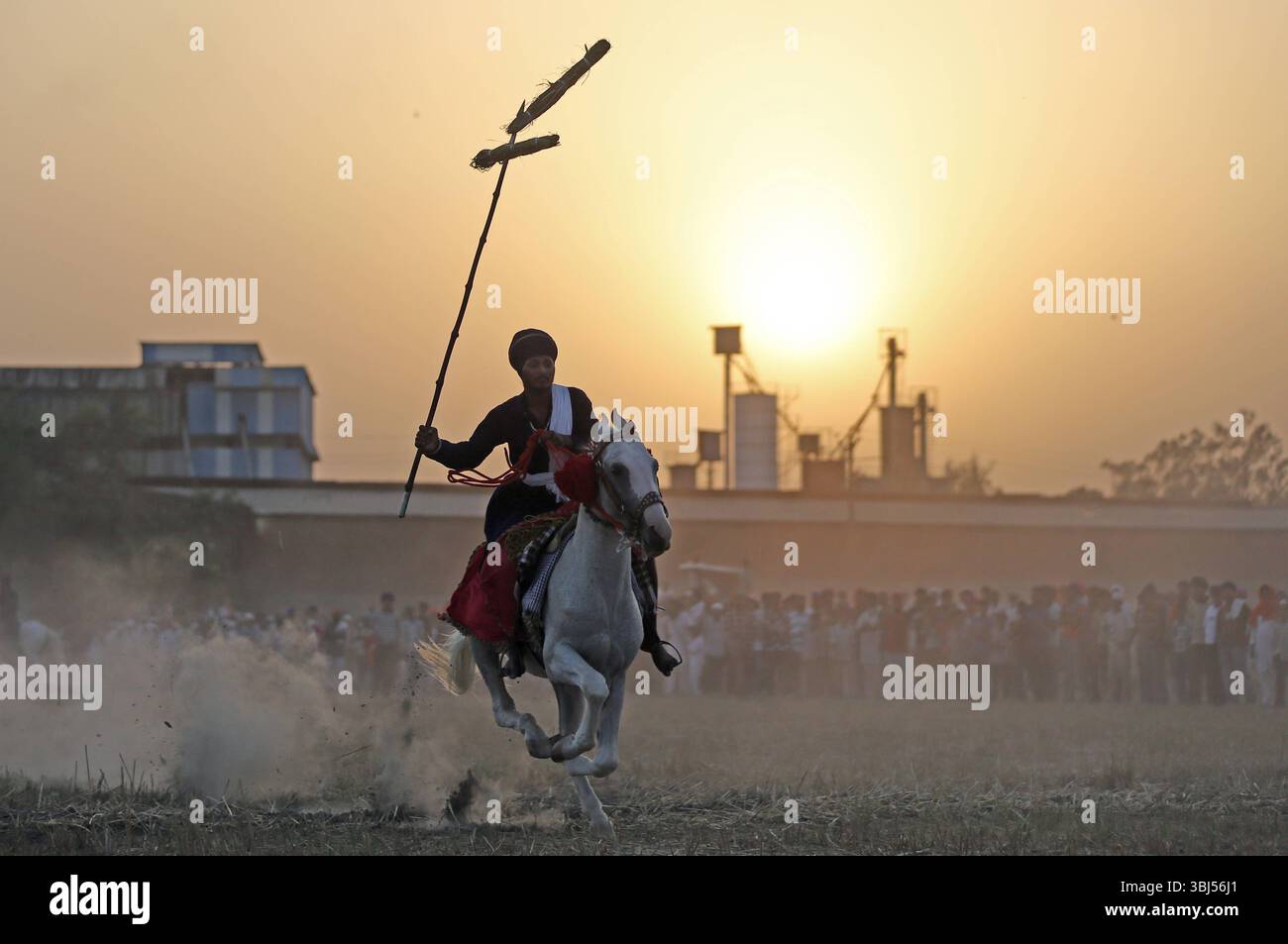 Traditional Sikh warrior order, Nihangs, in India A Nihang Sikh gallops ...