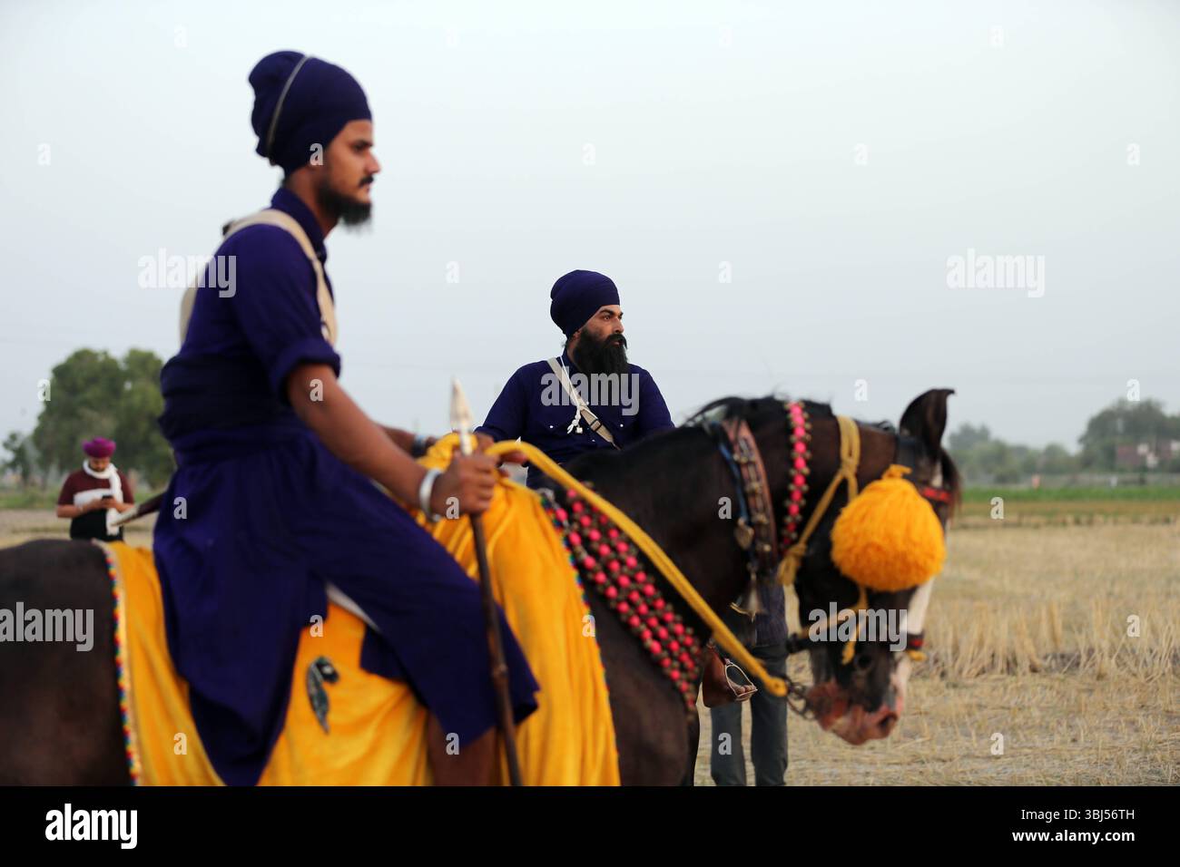 Traditional Sikh warrior order, Nihangs, in India Nihang Sikhs wait for their turns as they take ...