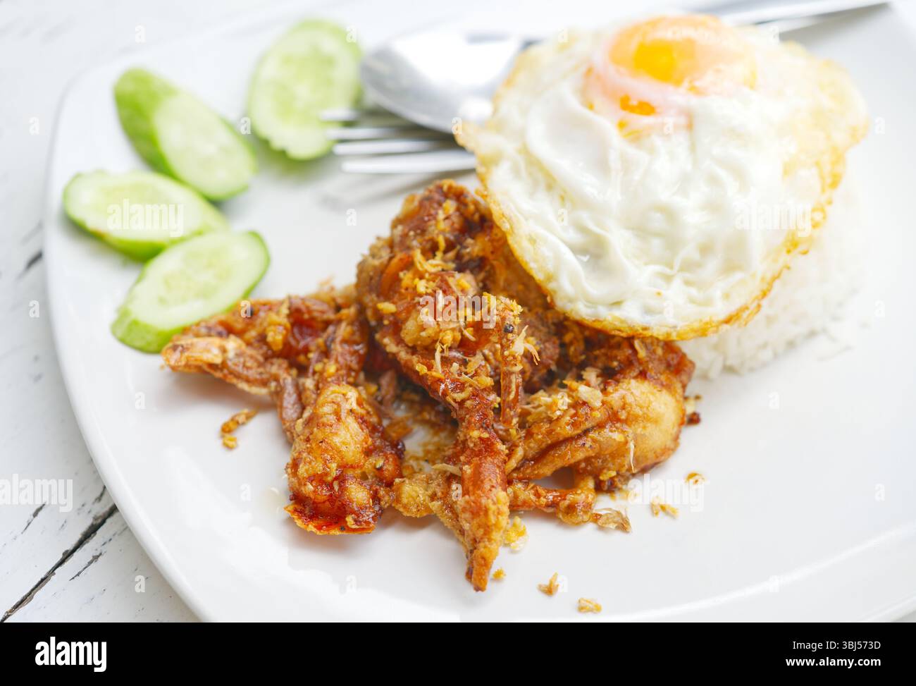 Deep-fried soft-shell crab with garlic, fried chicken egg, and jasmine ...