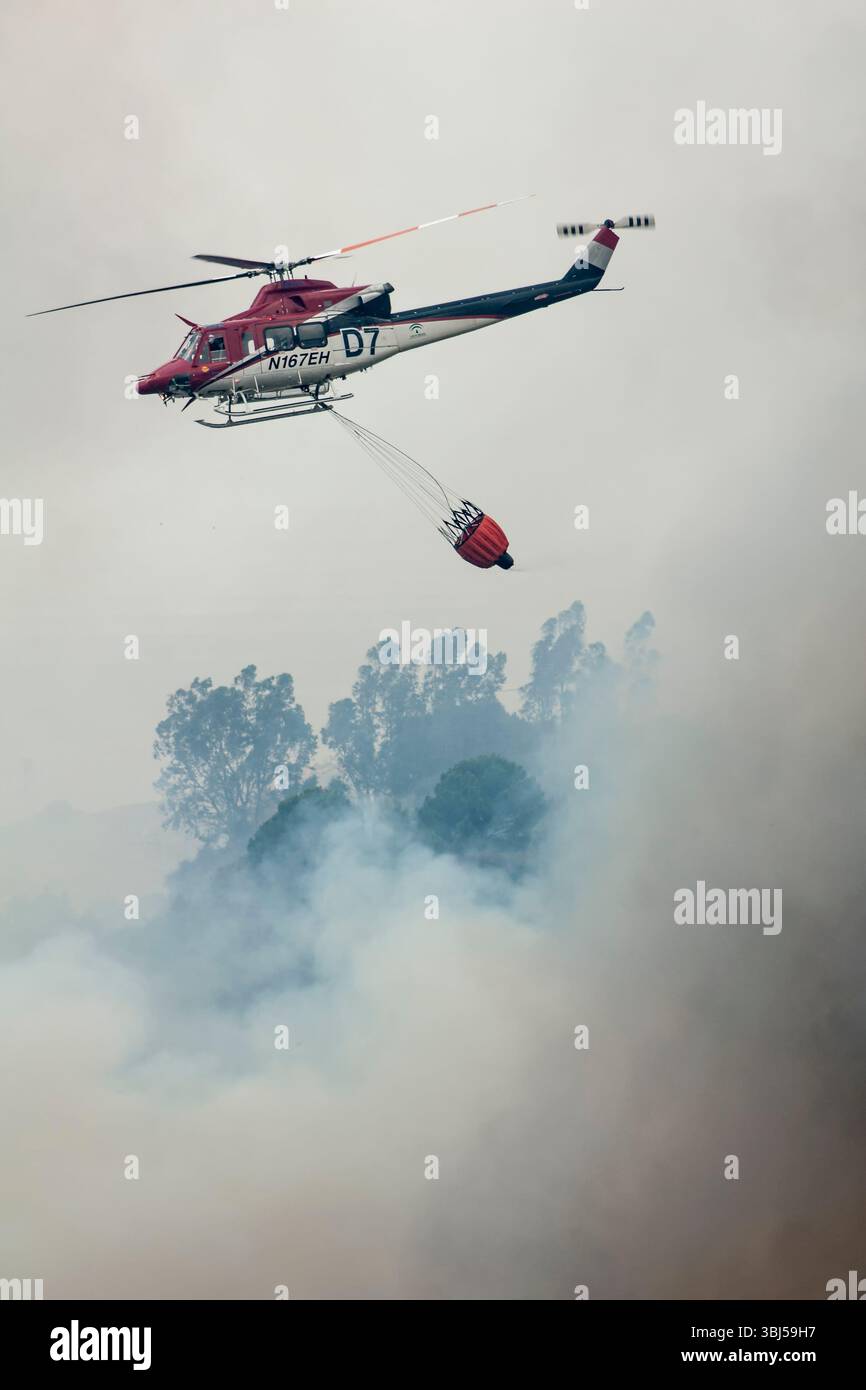 Helicopter in fire-fighting operation Stock Photo - Alamy
