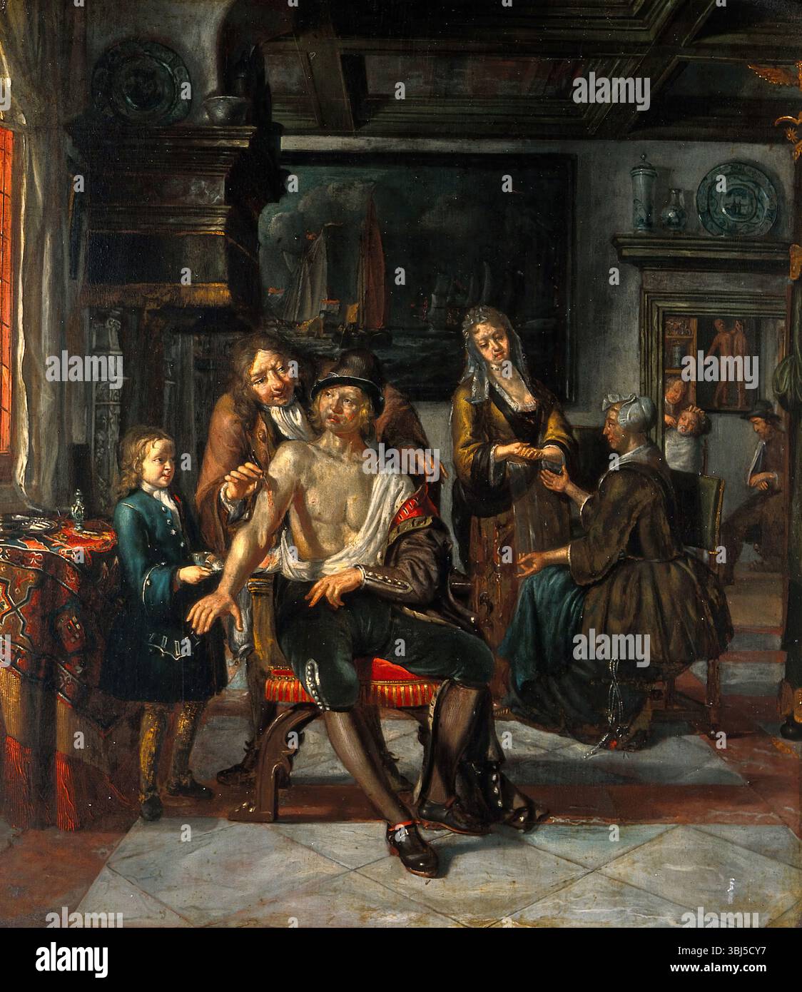 Interior of a surgery with a surgeon treating a wound in the arm of a ...