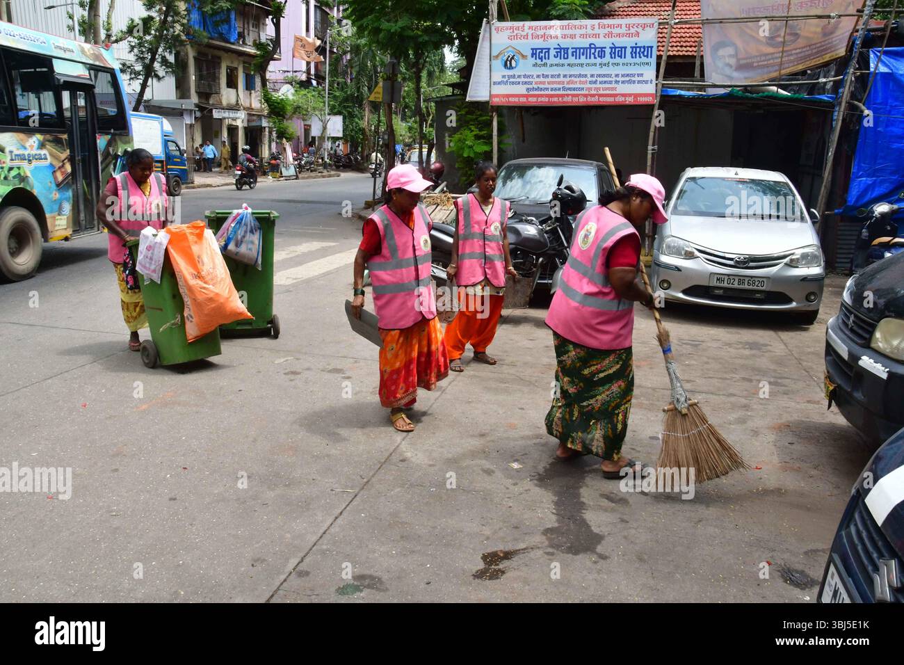 MUMBAI, INDIA - JUNE 11: BMC "Pink Army" women cleaning the streets ...