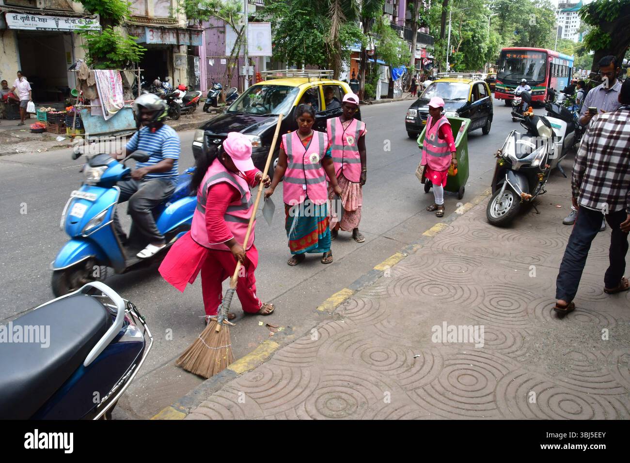 MUMBAI, INDIA - JUNE 11: BMC "Pink Army" women cleaning the streets ...
