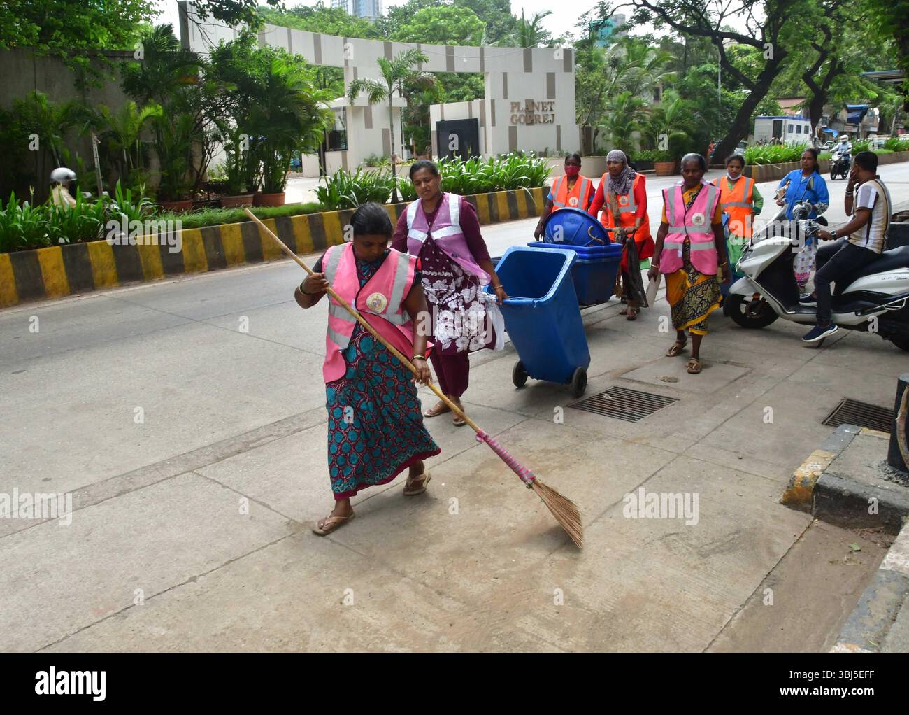 MUMBAI, INDIA - JUNE 11: BMC "Pink Army" women cleaning the streets ...