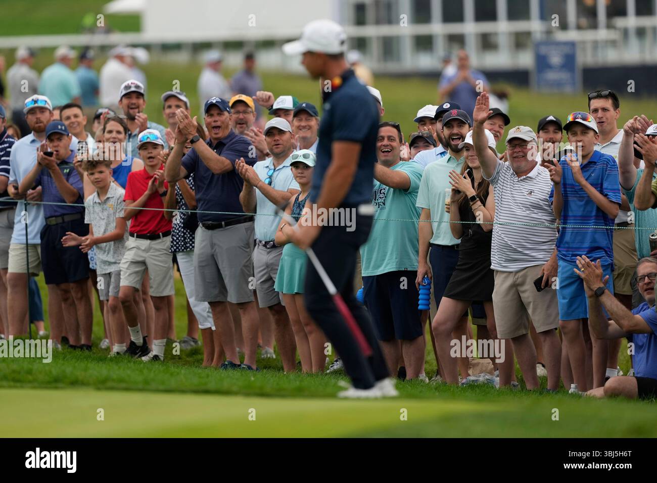 The crowd reacts to a birdie putt by Viktor Hovland, of Norway, on the ...