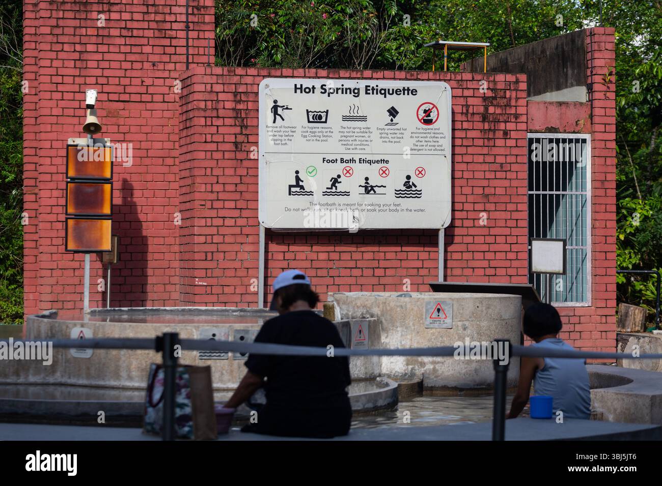 Free outdoors hot spring open to the public usage. A signboard showing ...
